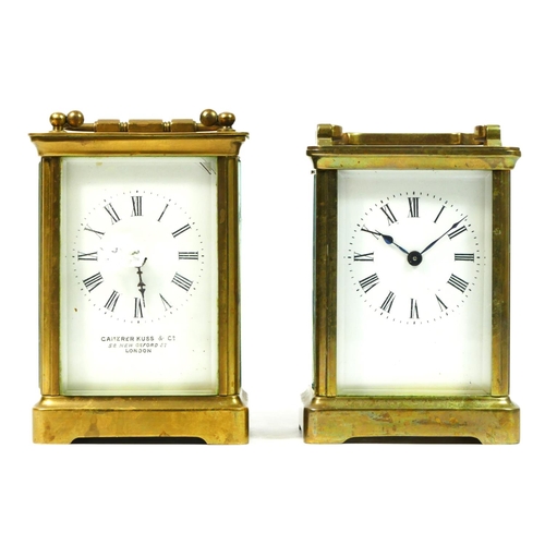 Two mid 20th century carriage clocks, having white enameled dials and ...