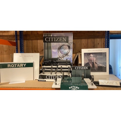An illuminated Citizen branded shop display watch stand with adjustable ...