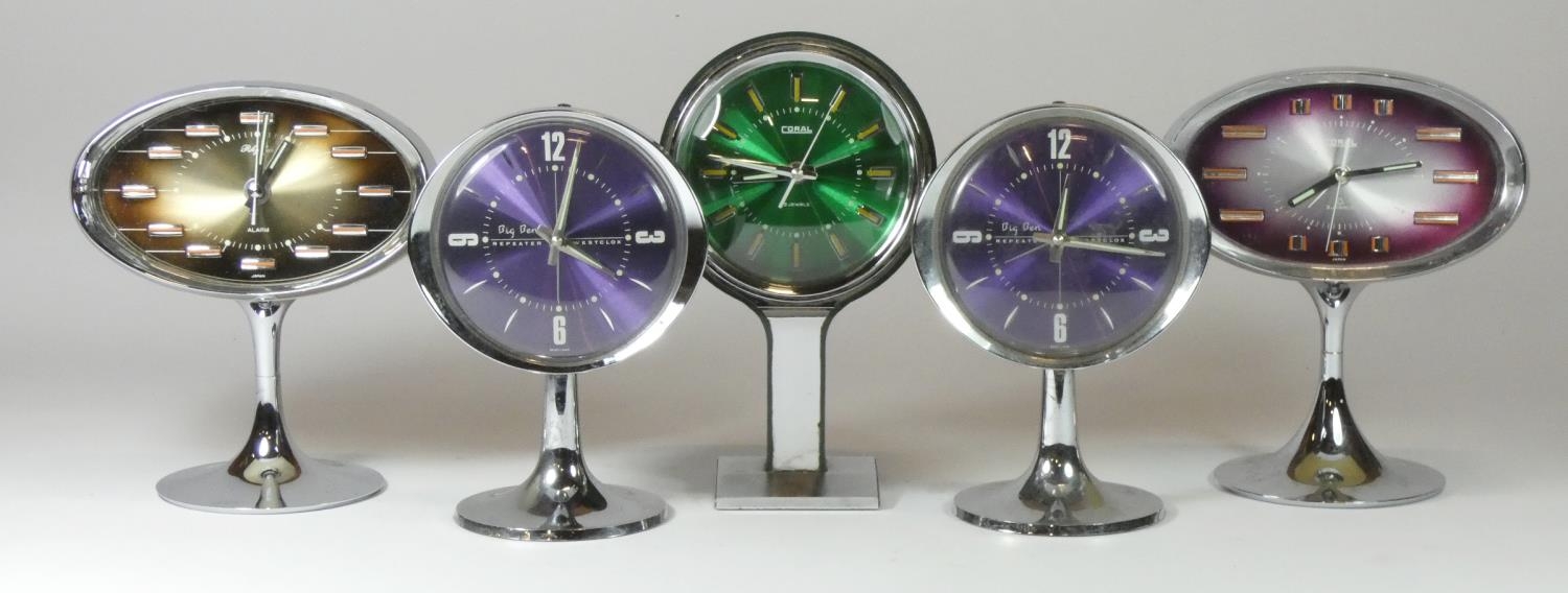 Five 1970s space age inspired desk clocks, to include two Corals, made ...