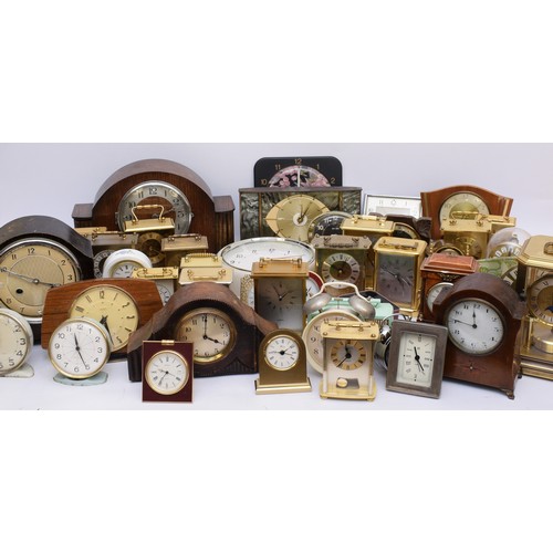 A collection of clocks, including a Kellogg's wall clock, a Smiths desk ...