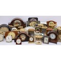 A collection of clocks, including a Kellogg's wall clock, a Smiths desk ...