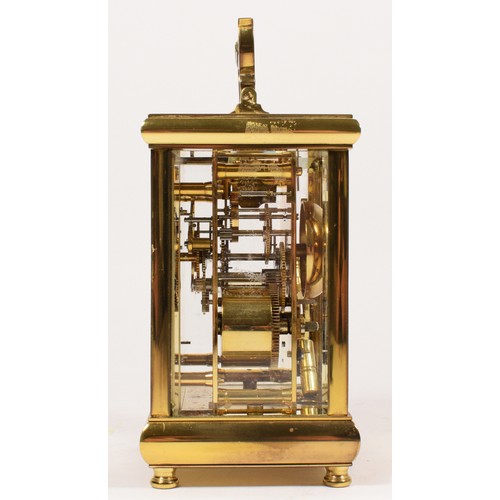 A Taylor & Bligh, brass striking carriage clock, white enamel dial with ...