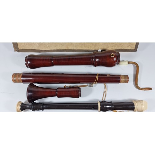 A Schott's wooden concert bass recorder together with a Dolonte tenor ...