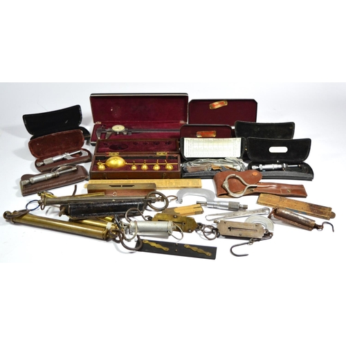 A collection of measuring devices, to include slide rules, calipers ...
