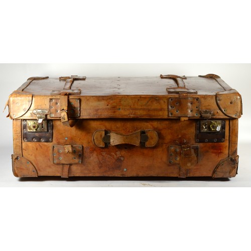 A late 19th century substantial tan leather traveling trunk/suitcase ...