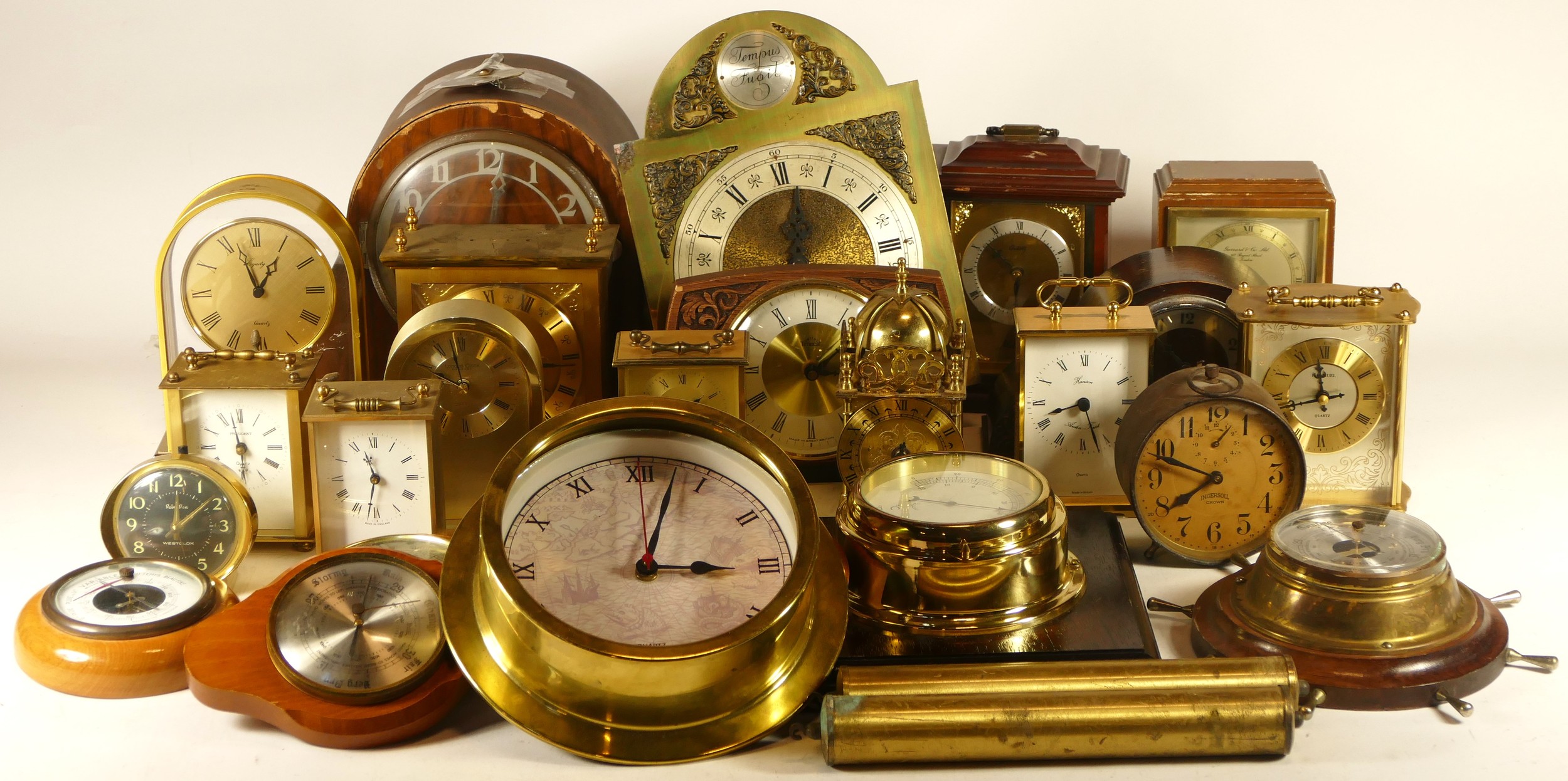 A collection of quartz and mechanical clocks, to include an Ingersoll ...