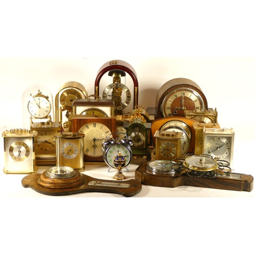 A collection of quartz and mechanical clocks, to include an Ingersoll ...