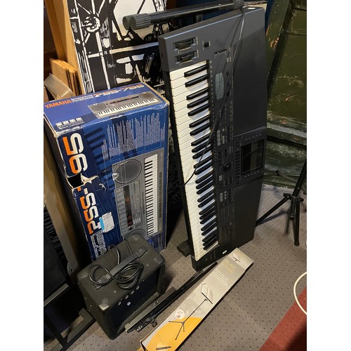 A Technics electronic keyboard with stand, model KN500, together with a ...