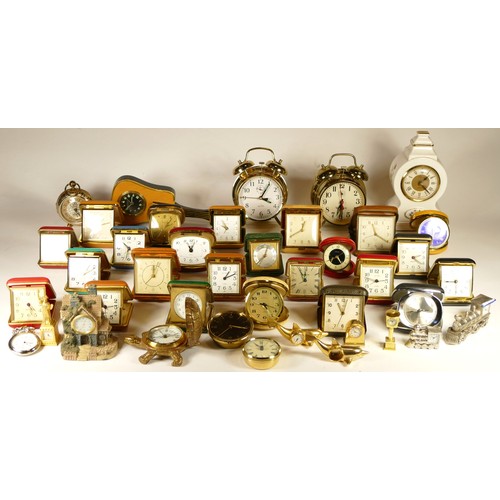 A collection of miniature novelty clocks, together with traveling alarm ...