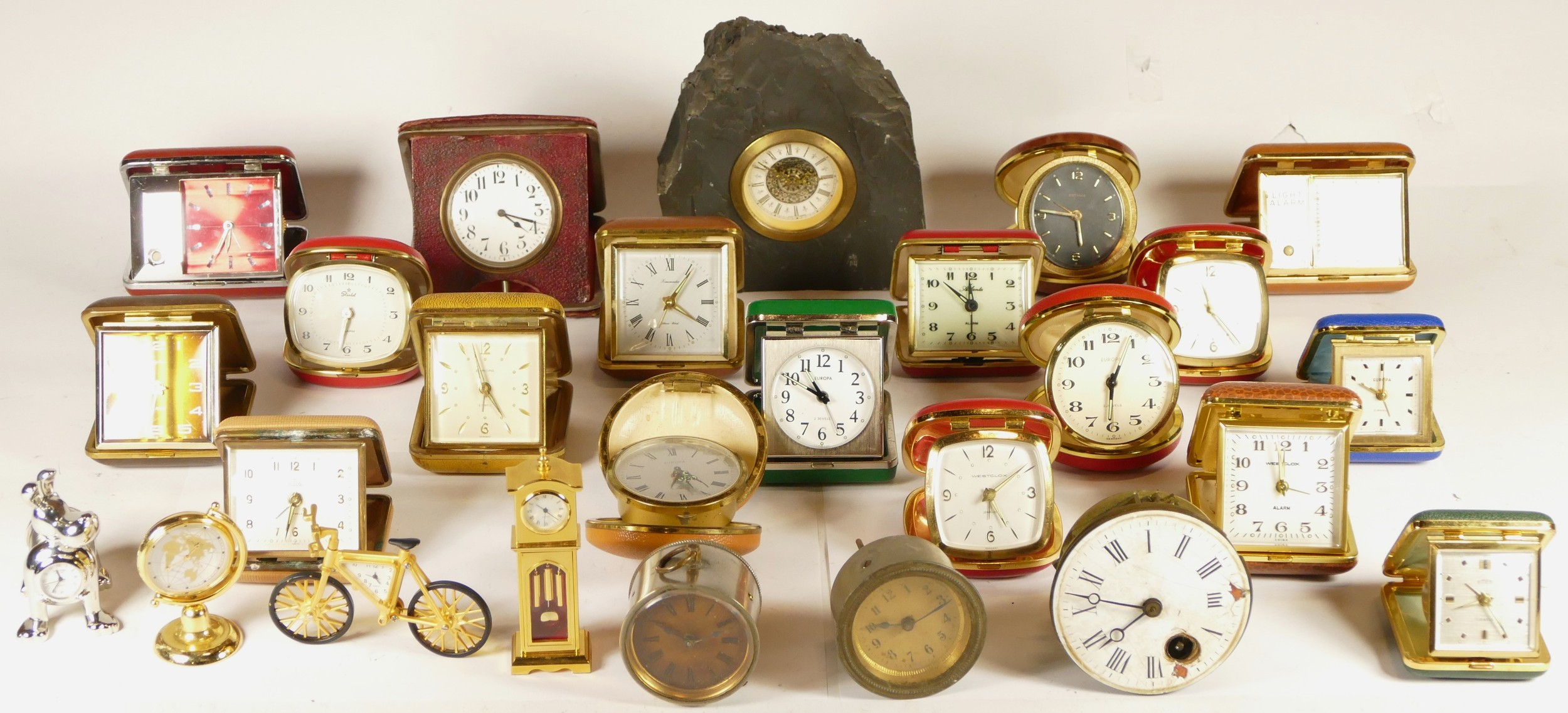 A collection of miniature novelty clocks, together with a quantity of ...
