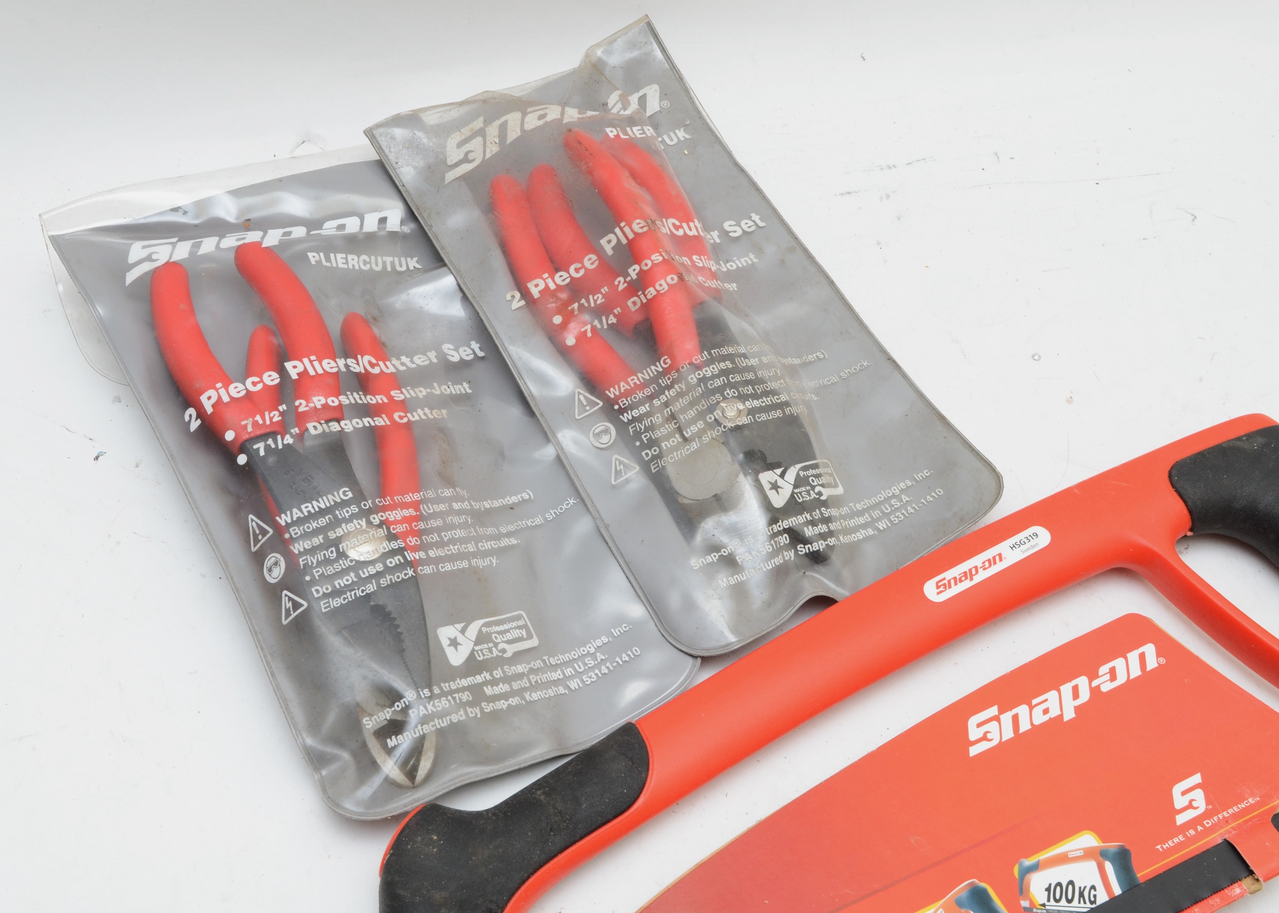 Snap On, Hacksaw HSG319, two sets of pliers and a screw driver