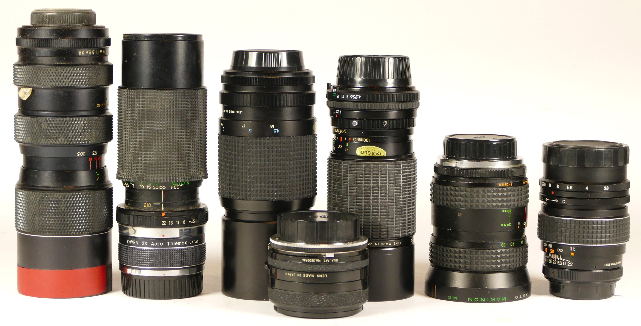 Seven assorted camera lenses comprising Sigma Zoom-K 1:4.5 f=100-200mm ...