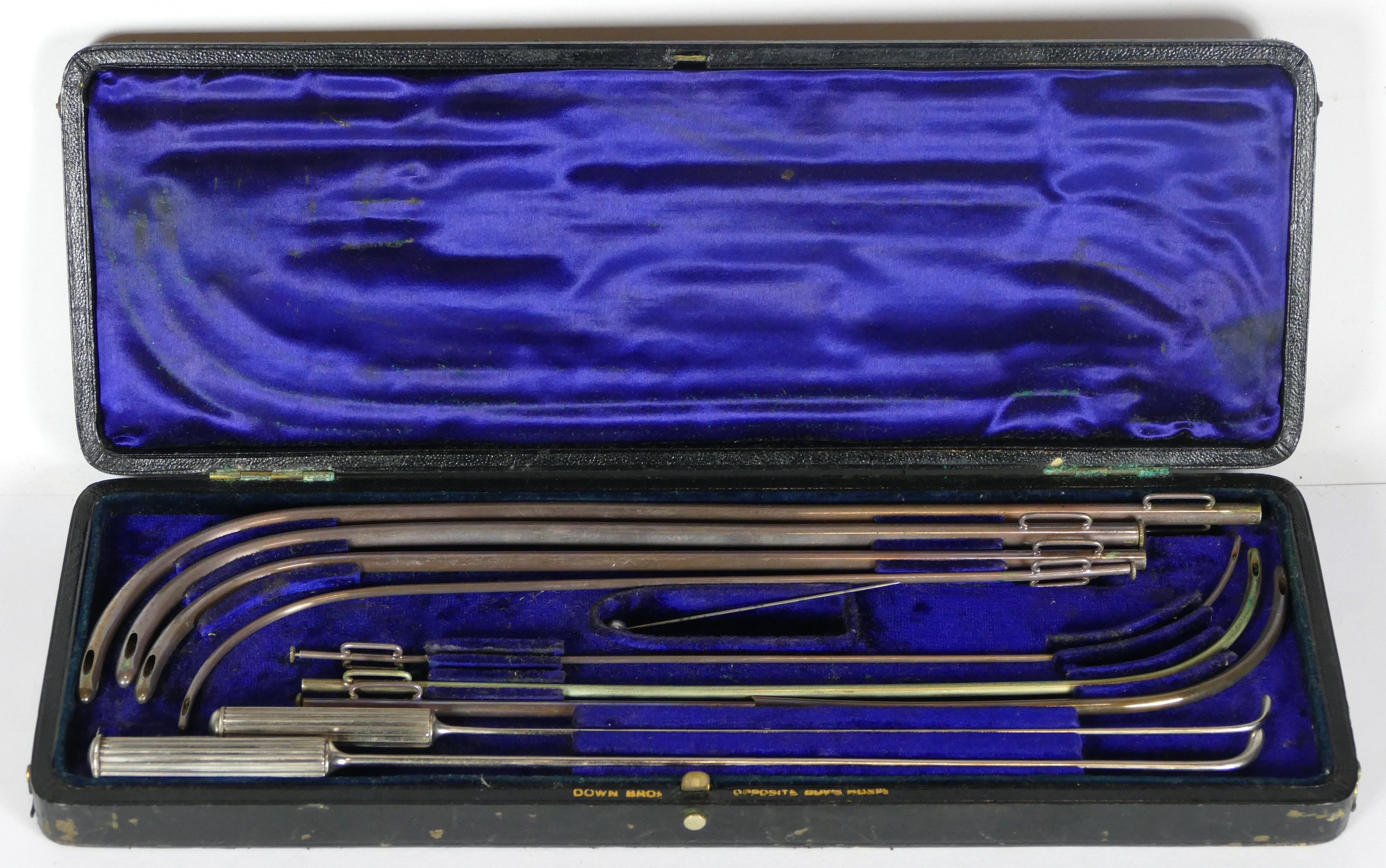 A 20th century cased silver plated catheter set, in black leather and ...