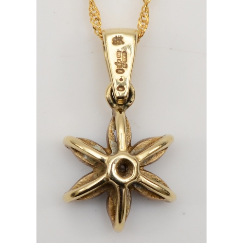 A 9ct gold tanzanite and brilliant cut diamond floral pendant, on chain ...