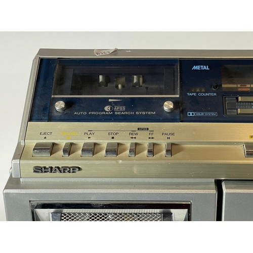 A Sharp portable music system, model VZ-2000E, comprising of tape ...