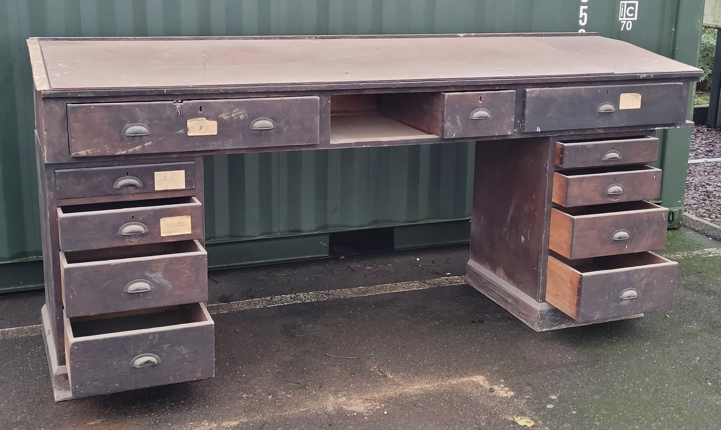 A large Victorian crackle glazed pine clerks desk, the sloped ...