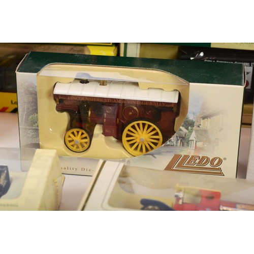 A collection of over fifty boxed diecast model vehicles, makers to ...