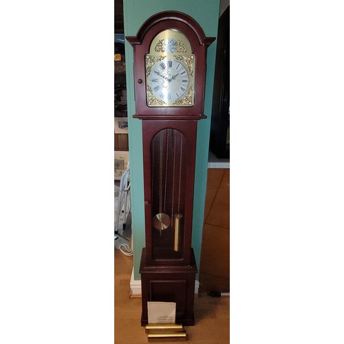 A contemporary German mahogany effect triple weight Grandmother clock ...
