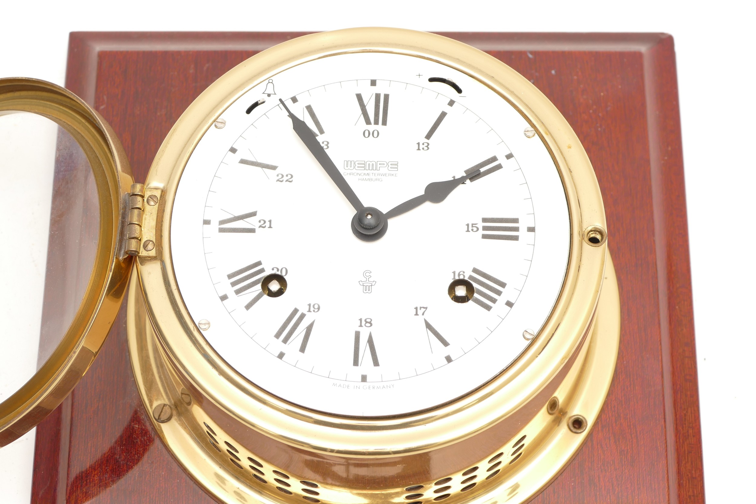 A 20th century Wempe of Germany brass cased striking clock, mounted on ...