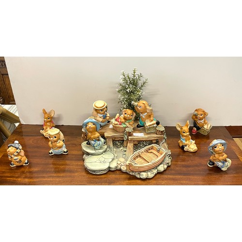 Pendelfin; a collection of twenty four rabbits and two display stands ...