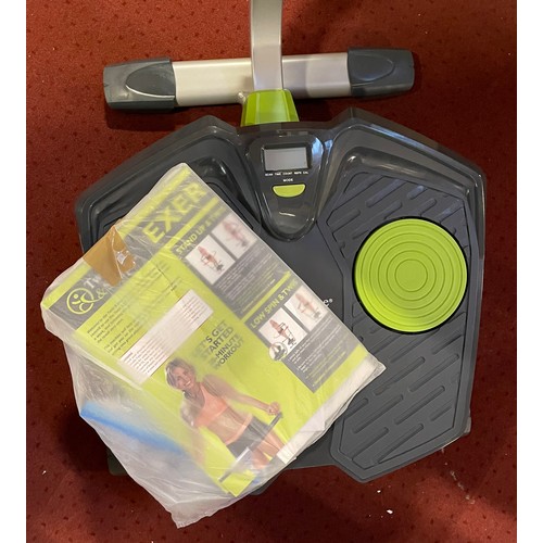 An Exer 'Twist and Shape' fitness machine, complete with instructions ...