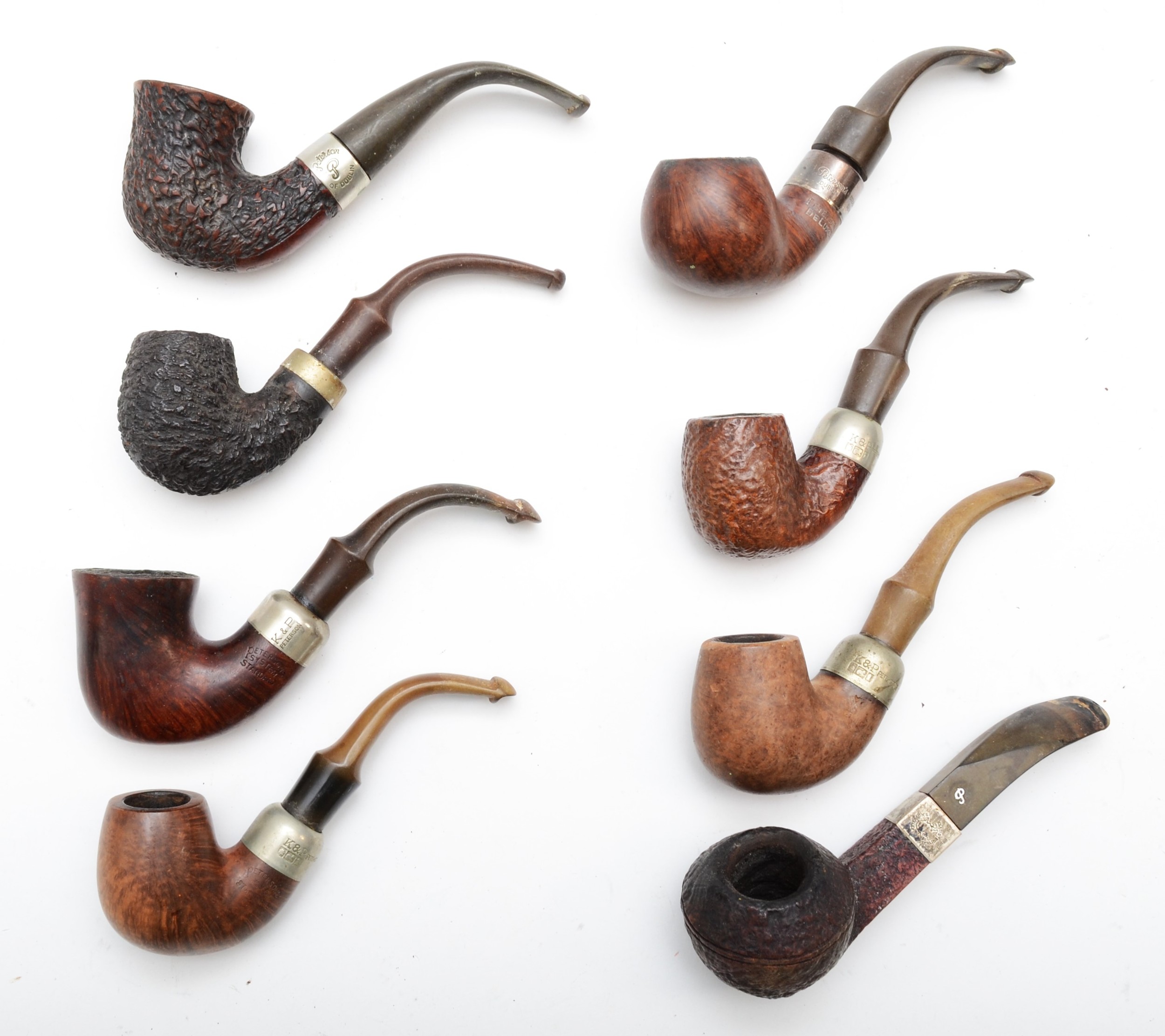 Seven Peterson Irish tobacco pipes to include two silver collared ...
