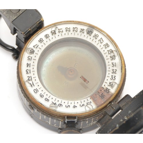 A WWII British military compass, by T.G.Co Ltd, London, numbered 43557 ...