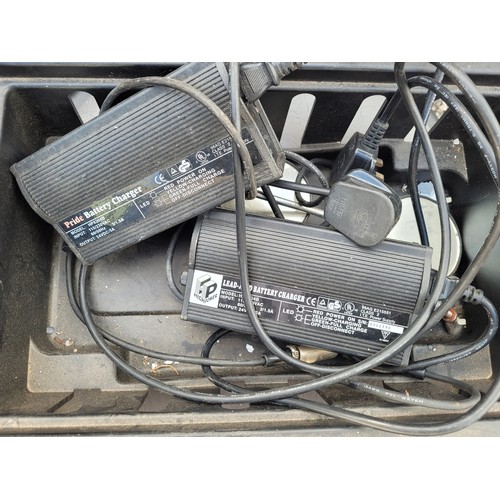 A Strider four wheeled mobility scooter, with An Aqua mobility scooter ...