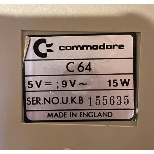 A Commodore C64 computer, together with a Amstrad CPC 464 computer. (2)