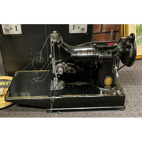 A mid 20th century electric Singer sewing machine, cased, model number 221K