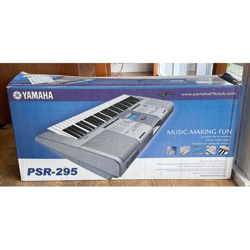 A Yamaha electronic keyboard, model PSR-295, boxed.