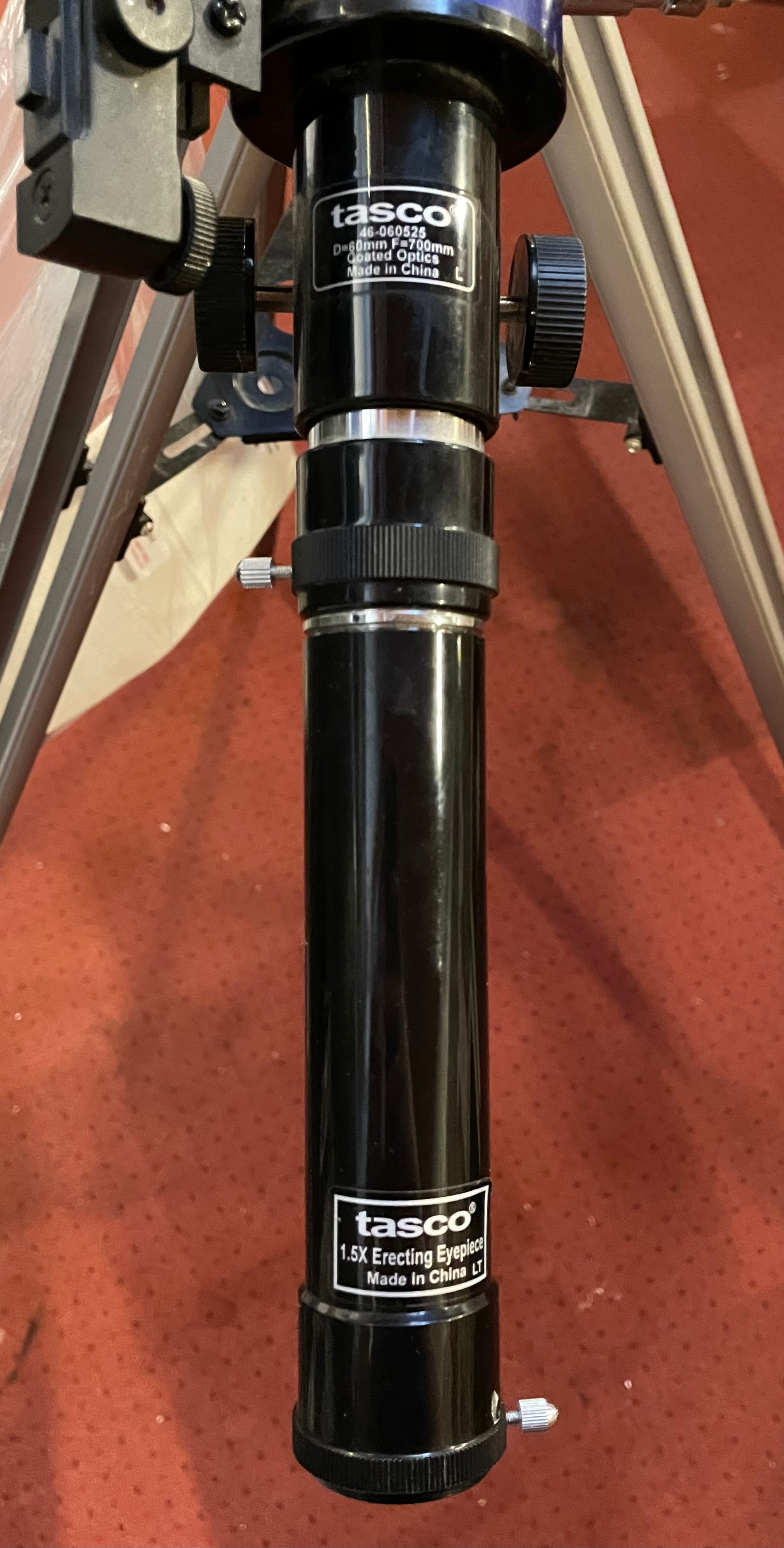 A modern Tasco 'Galaxsee' telescope on adjustable trypod, with ...