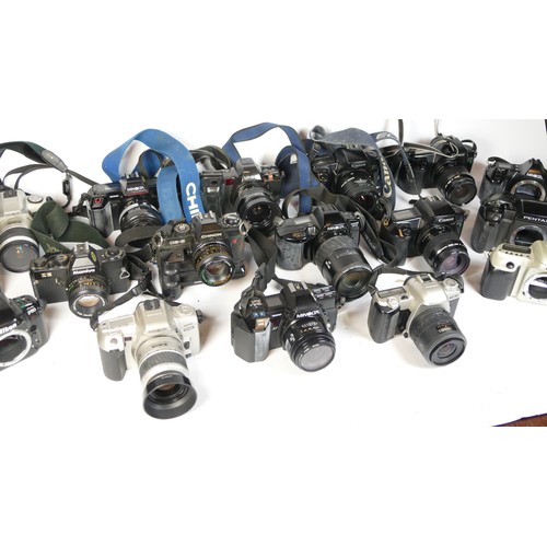 Twenty three SLR vintage film cameras to include a Canon EOS 500, a ...