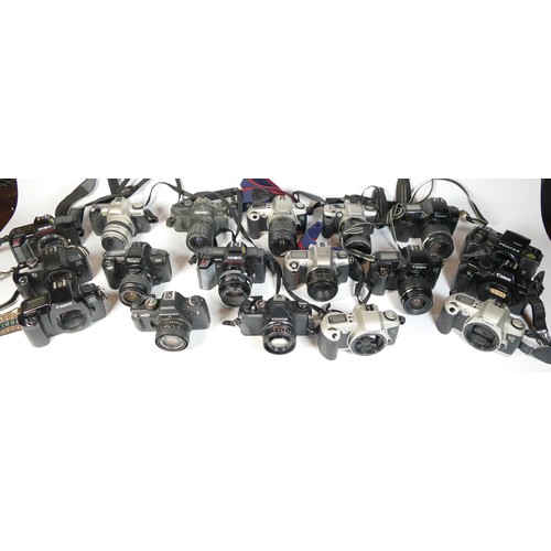 Twenty five SLR vintage film cameras to include a Cosina C1, a Canon ...