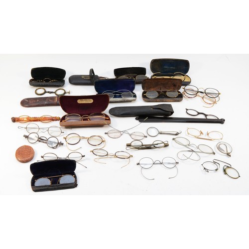 A collection of early 20th century and later spectacles, cased and loose.