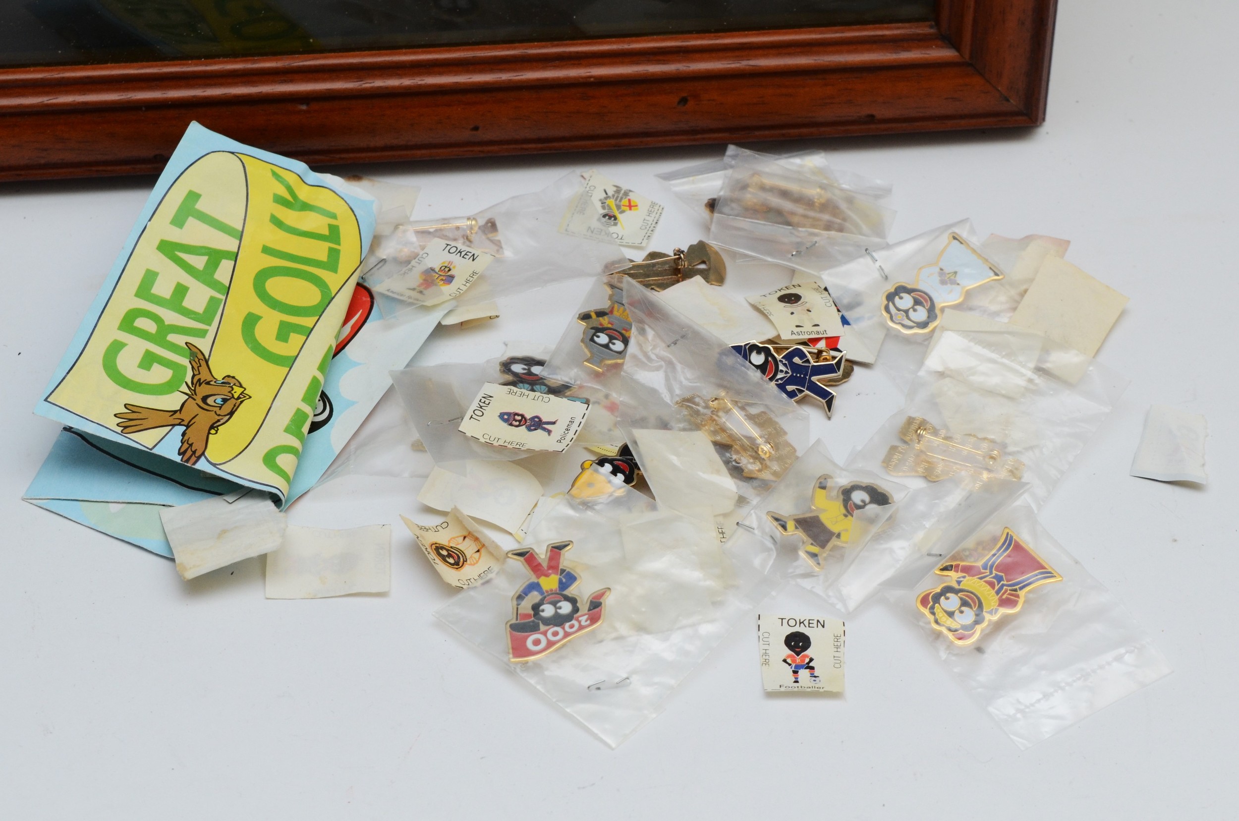 Collection of Robertsons enamelled Golly pin badges, loose and framed ...