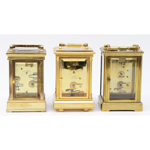 Three 20th century brass carriage clocks, having enamelled dials and 8 ...