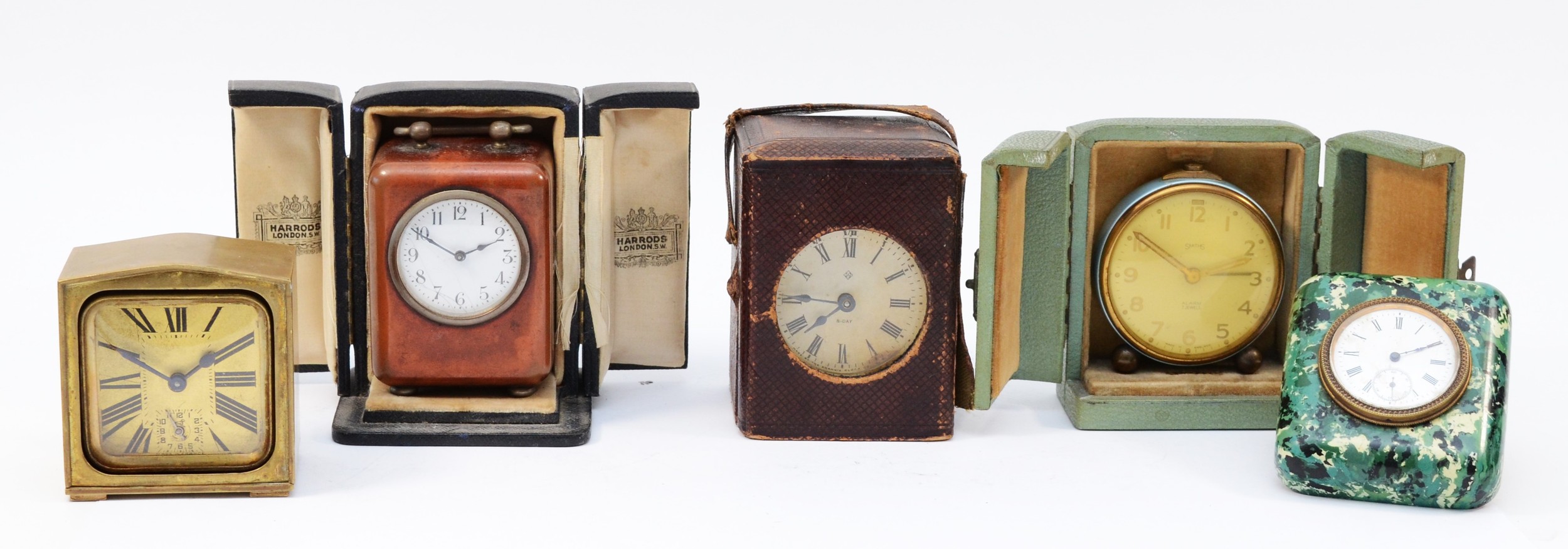 A collection of five bedside/traveling clocks, circa 1920s-50s, having ...