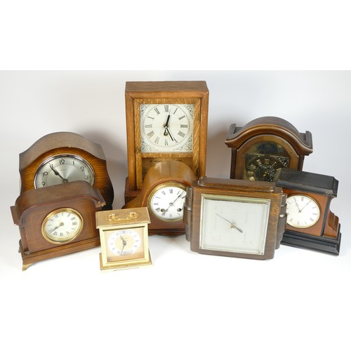 A collection of mid 20th century and later mantel clocks, alarm clocks ...