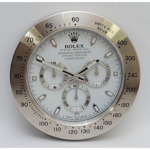 A 'Rolex' style advertising wall clock, white dial reads 'Rolex Oyster ...