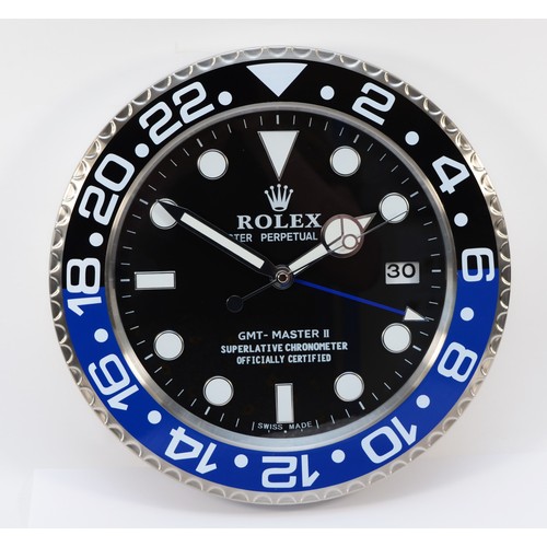 A 'Rolex' style advertising wall clock, black dial reads 'Rolex Oyster ...