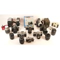 A collection of mixed cameras and accessories to include four digital ...