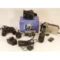 A collection of mixed cameras and accessories to include two digital ...