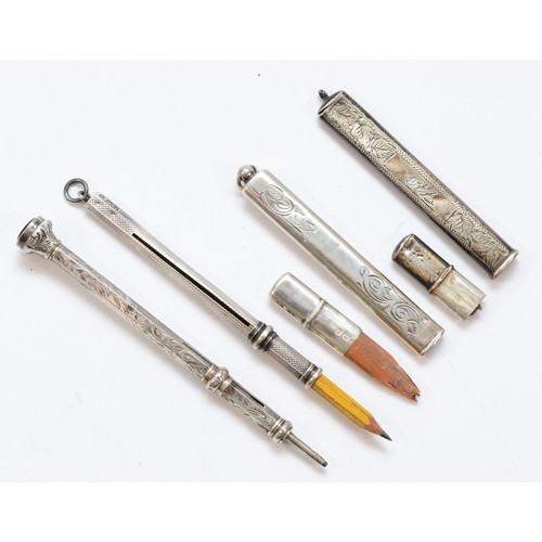 A Victorian silver propelling pencil, Birmingham 1897, another 1912 and ...