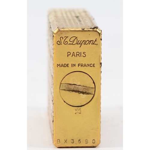 S.T. Dupont, a gold plated rollagas lighter, number BX3690, crocodile case
