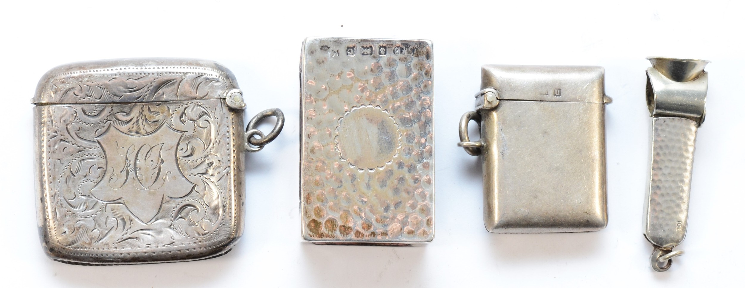 Two silver vesta cases, Birmingham 1905 and 1919, a silver match box ...