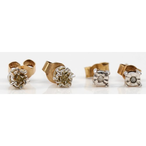 Two pairs of 9ct gold diamond single stone stud earrings, 1g