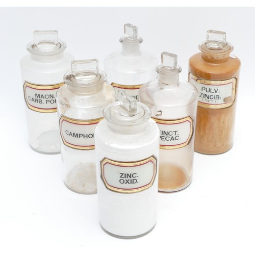 A collection of six 19th century pharmacy glass bottles, with various ...