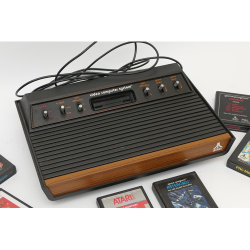 An Atari games console, model CX-2600 U, with power lead and six games.