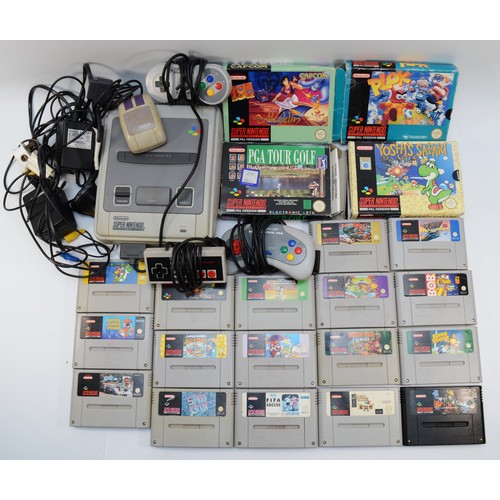 A Super Nintendo console, with controllers, cables and several games to ...